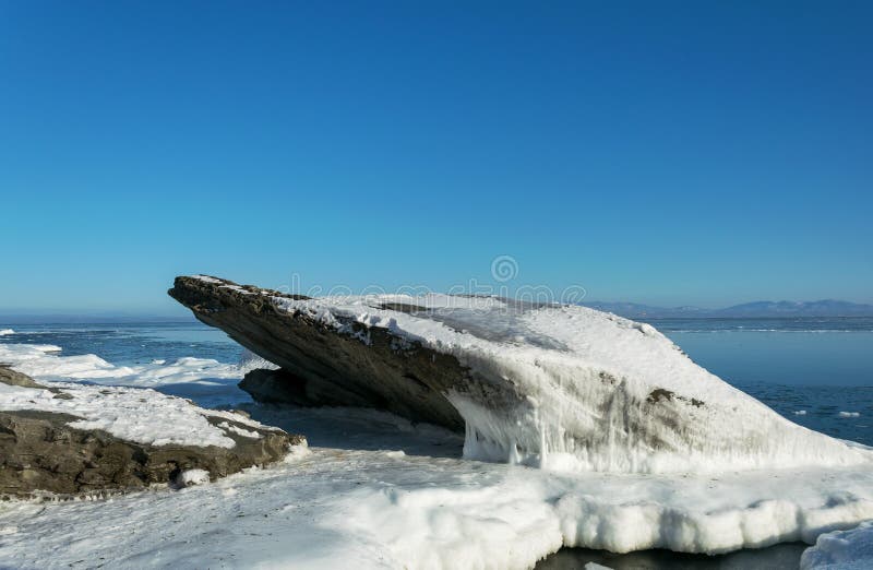 Frozen Rocks in the Sea on a Sunny Winter Day. Stock Photo - Image of ...
