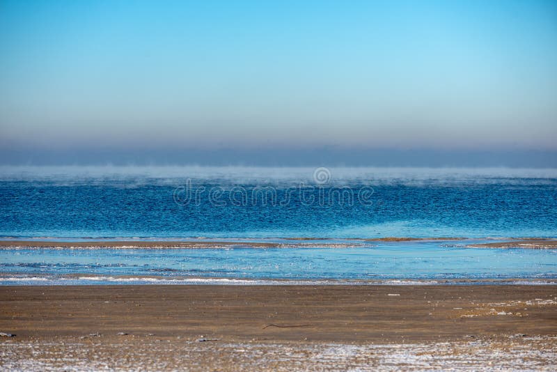 Frozen Sea Beach in Winter with Low Snow Coverage Stock Photo - Image ...