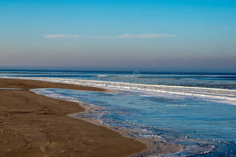 Frozen Sea Beach in Winter with Low Snow Coverage Stock Image - Image ...