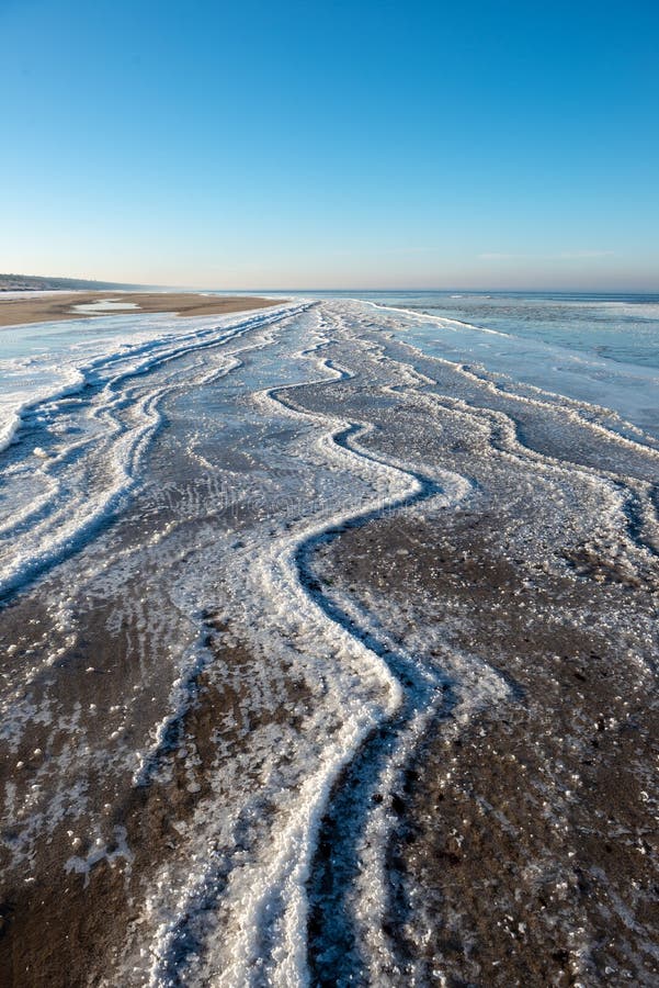 Frozen Sea Beach in Winter with Low Snow Coverage Stock Image - Image ...