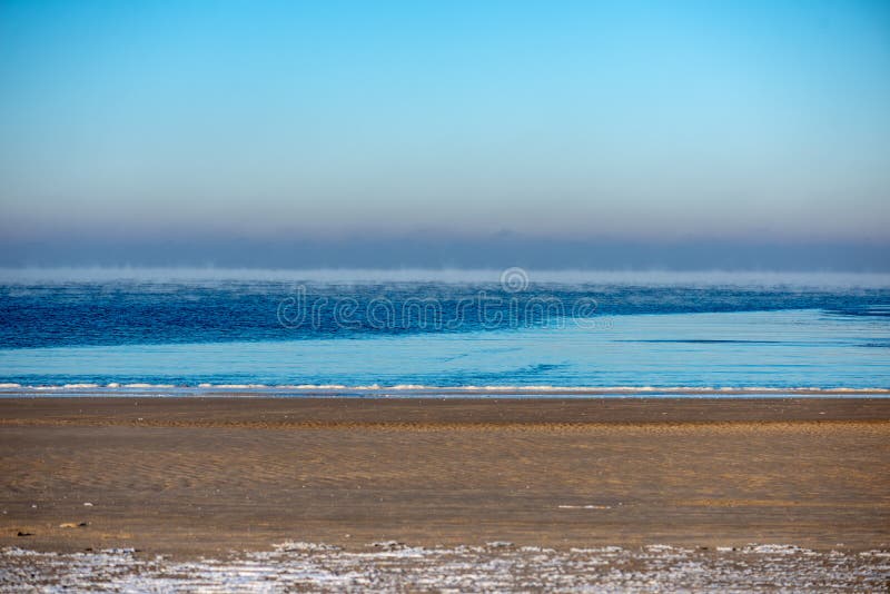 Frozen Sea Beach in Winter with Low Snow Coverage Stock Image - Image ...