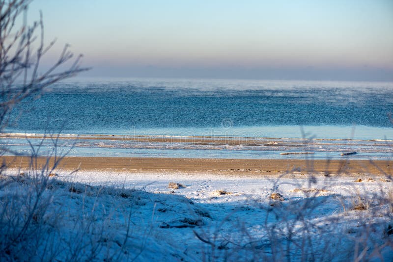 Frozen Sea Beach in Winter with Low Snow Coverage Stock Image - Image ...