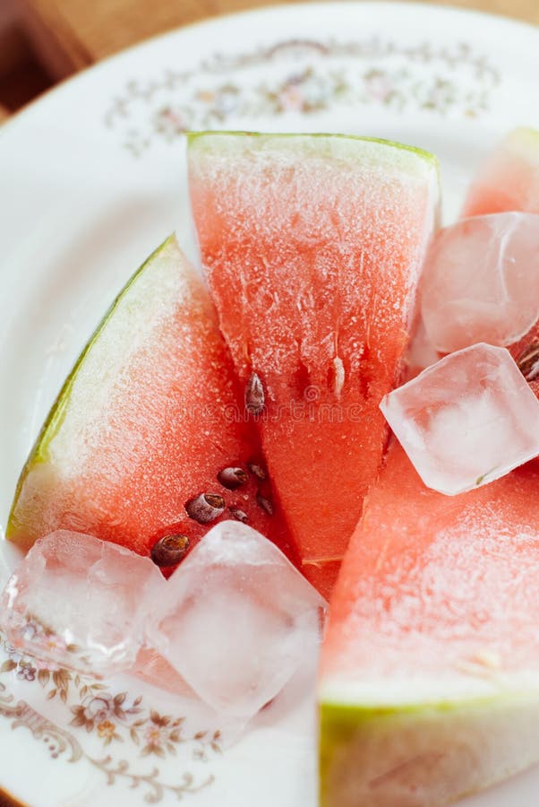 Frozen Slices of Watermelon on White Plate Stock Image - Image of ...