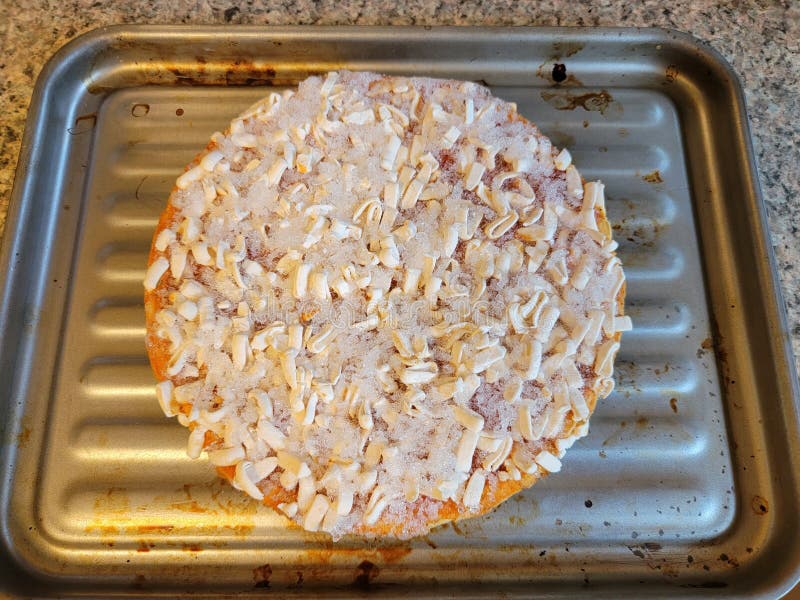 Frozen Small Circular Pizza with Ice on Metal Tray Stock Image - Image ...