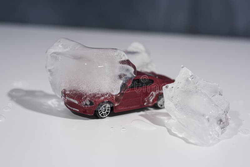 Frozen Small Red Car in Ice. Abstract Winter Driving Concept Stock ...