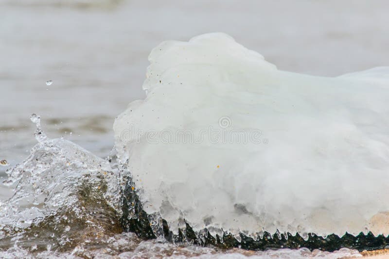 Frozen stone in water stock image. Image of splashing - 110824759