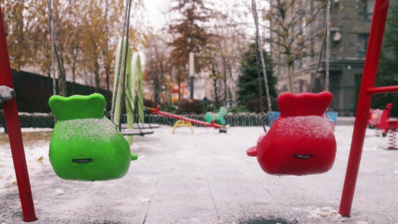 Frozen Swing on Children Playground in Snow on Cold Winter Day ...