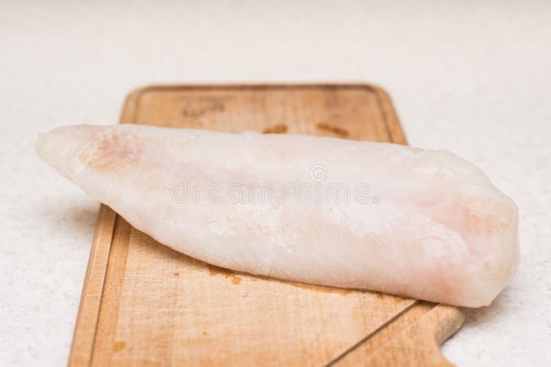 Frozen Thawed Fish Fillet Cutting Board Stock Photos - Free & Royalty ...