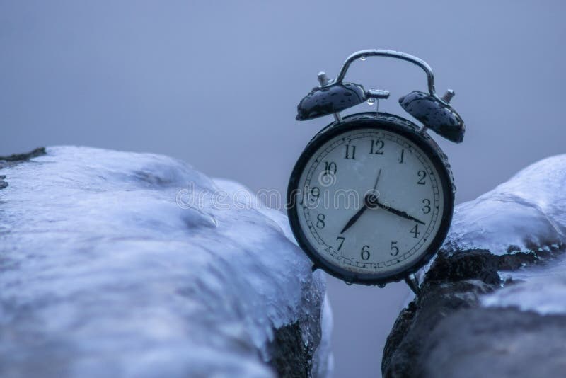 Frozen Time. a Clock Frozen in Ice. Extreme Weather Situation. Daylight ...