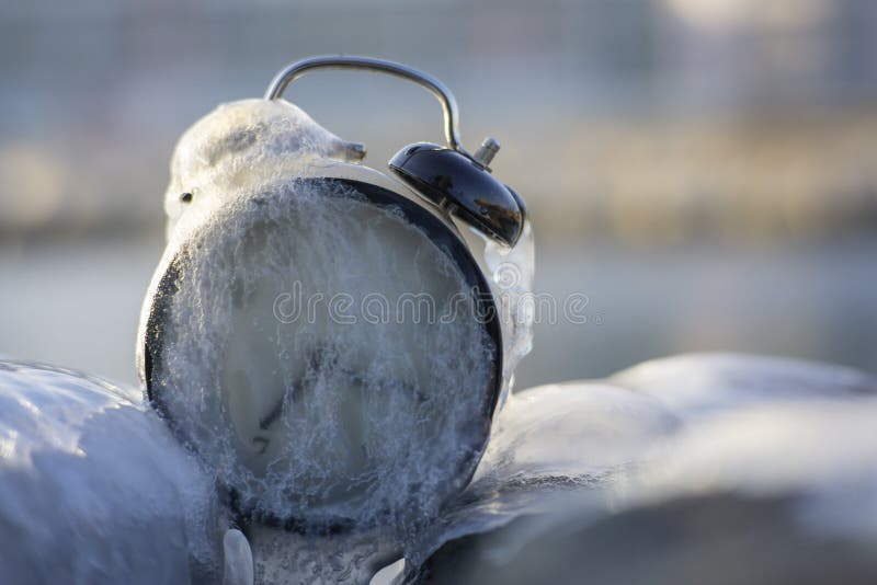 Frozen Time. a Clock Frozen in Ice. Extreme Weather Situation. Daylight ...