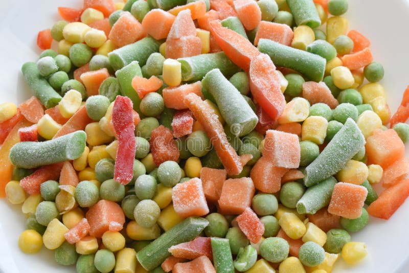 Frozen Vegetables on a White Plate. Stock Image - Image of container ...