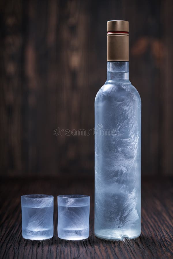 Frozen Vodka in Small Glass on Wooden Table, Selective Focus Stock ...