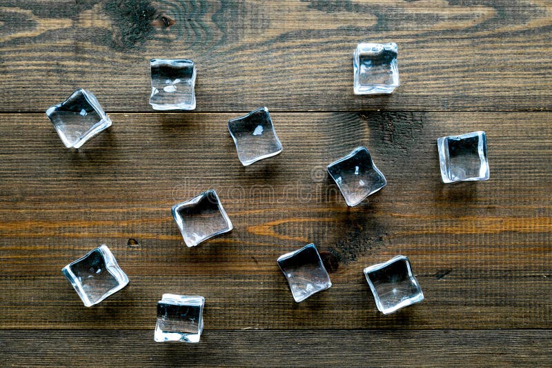 Frozen Water in Ice Cubes on Wooden Bar Table Top View Stock Photo ...