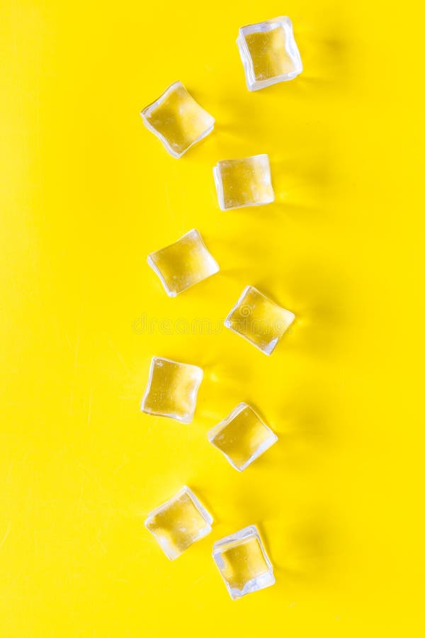 Ice Cubes on Yellow Table Top View Mock Up Stock Photo - Image of ...