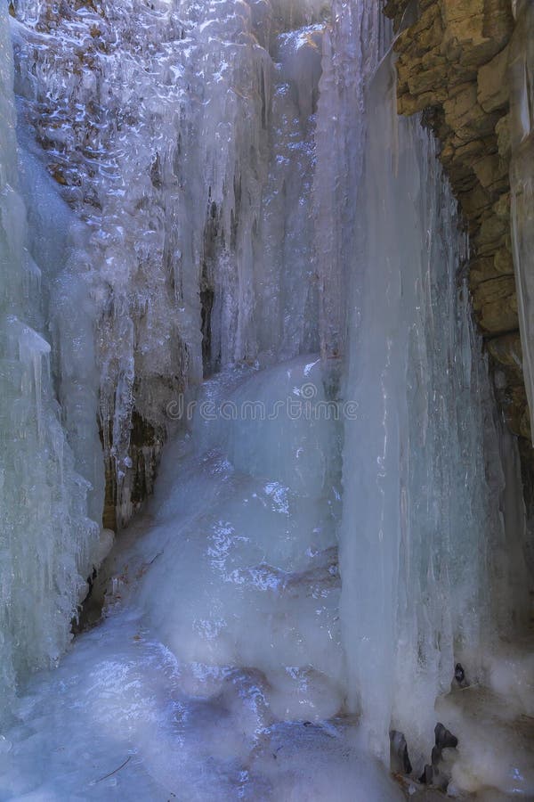 Frozen Waterfall in a Gorge High in the Mountains Stock Image - Image ...