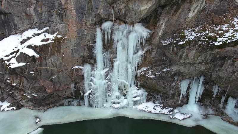 Frozen Waterfall in a Gorge with a Mountain River Stock Video - Video ...