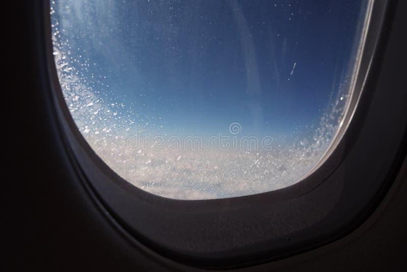 Frozen Window Inside Airplane Covered with Ice during Flight, Closeup ...