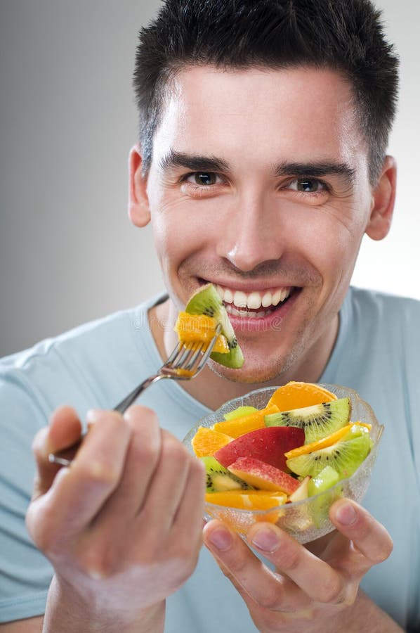 10,946 Young Man Eating Fruit Stock Photos - Free & Royalty-Free Stock ...