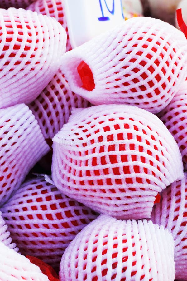 Fruit Apple - Wrapped with Foam on the Market. Stock Photo - Image of ...