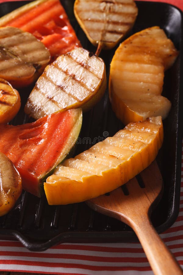 Fruit Apples, Melon, Pears, Watermelon on a Grill Pan Macro. Vertical ...