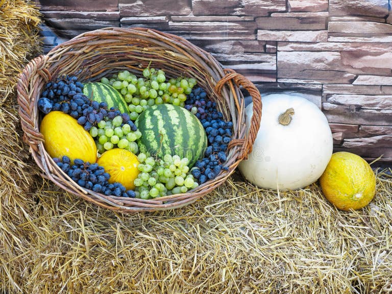 Fruit Basket with Melon, Watermelon Grapes,on Straw Stock Photo - Image ...