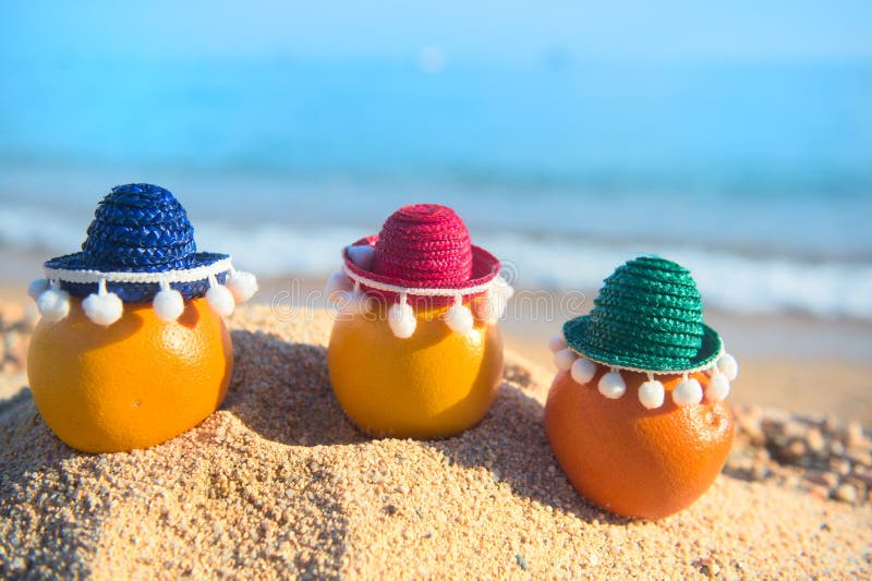 Fruit at the beach stock photo. Image of oranges, sombrero - 76541328