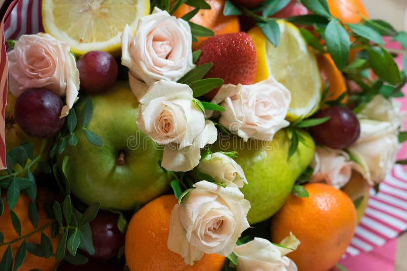 Fruit and Berry Bouquet with Roses in a Package Stock Photo - Image of ...