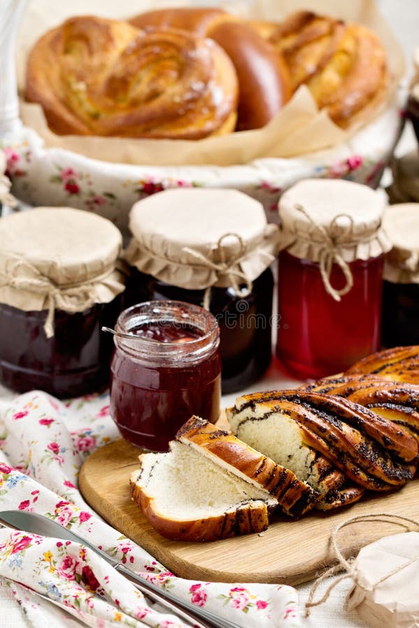 Fruit and Berry Jam in Jars. Different Kinds of Buns Stock Image ...