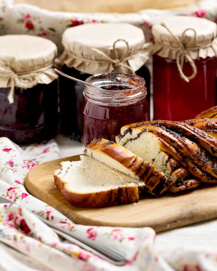 Fruit and Berry Jam in Jars. Different Kinds of Buns. Stock Image ...