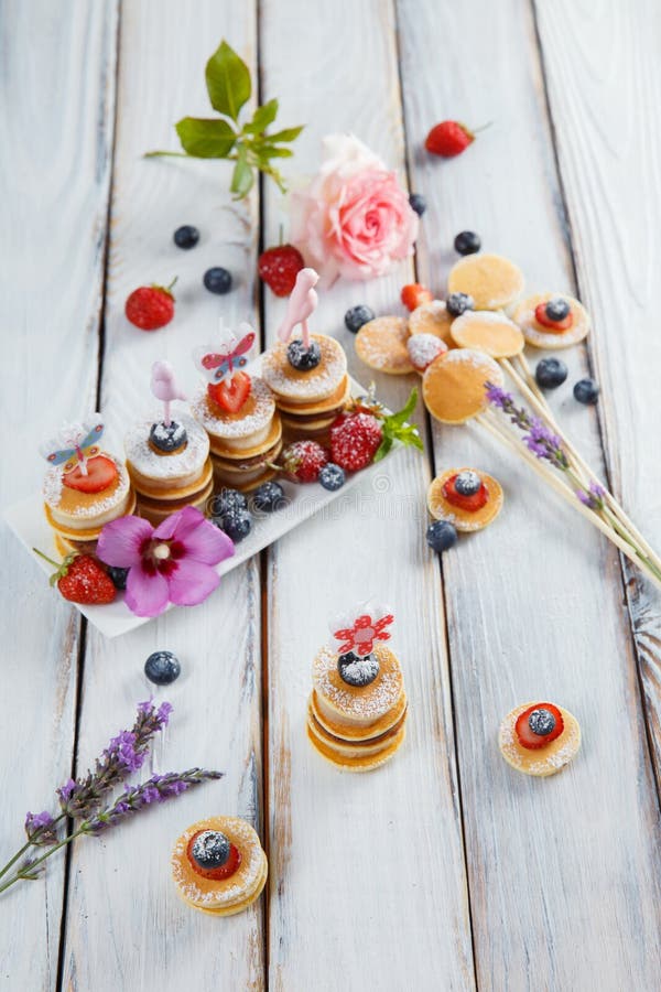 Fruit, Berry and Pancake Canapes on White Wooden Table Stock Photo ...