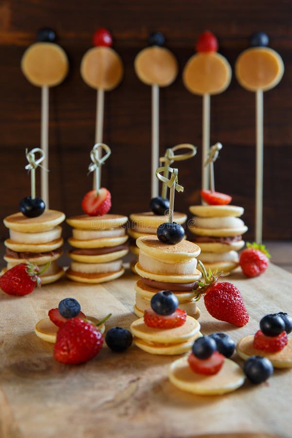 Fruit, Berry and Pancake Canapes on White Wooden Table Stock Image ...