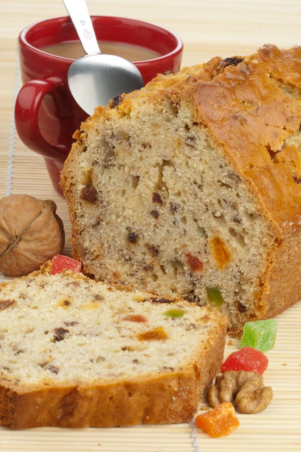 Fruit cake on a wooden pad stock photo. Image of crusty - 18052980