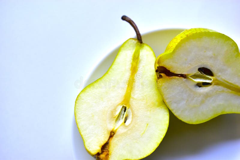 Fruit of a Cut Green Pear on a White Plate Stock Image - Image of fresh ...