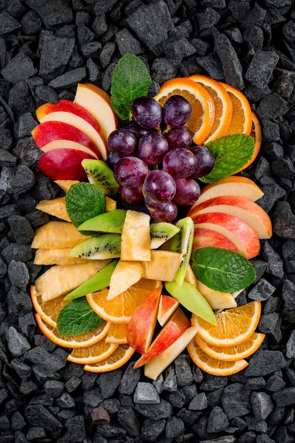 Fruit Cuts Dish with Apples Oranges Kiwi Pineapple Grapes with Mint ...