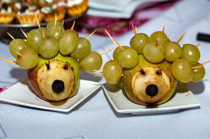 Fruit Dessert. Hedgehog Made of Pears and Grapes. Stock Image - Image ...
