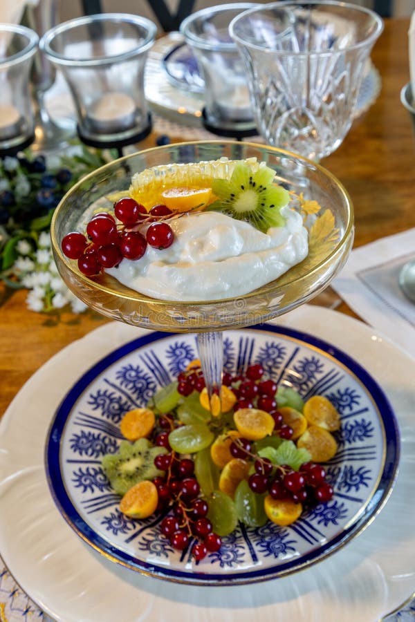 Fruit and Greek Yogurt Breakfast with a Slice of Honey Comb and Golden ...