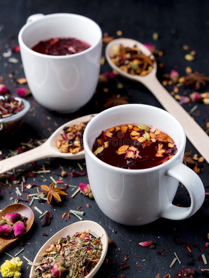 Fruit and Herbal Tea in Two White Cup on Dark Concrete Baclground Stock ...
