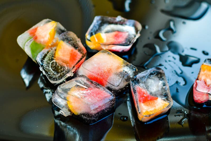 Fruit in ice cubes. stock photo. Image of culinary, bright - 110223642