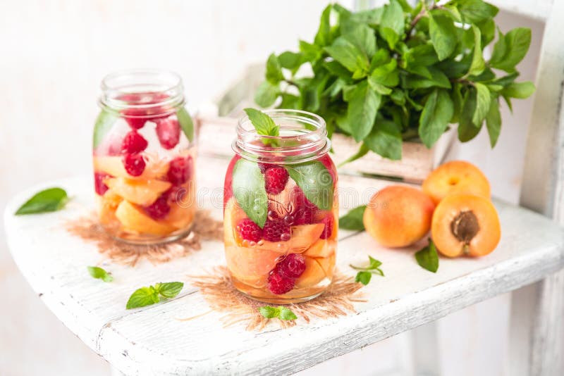 Fruit Infused Detox Water with Apricots Raspberries and Mint Stock ...