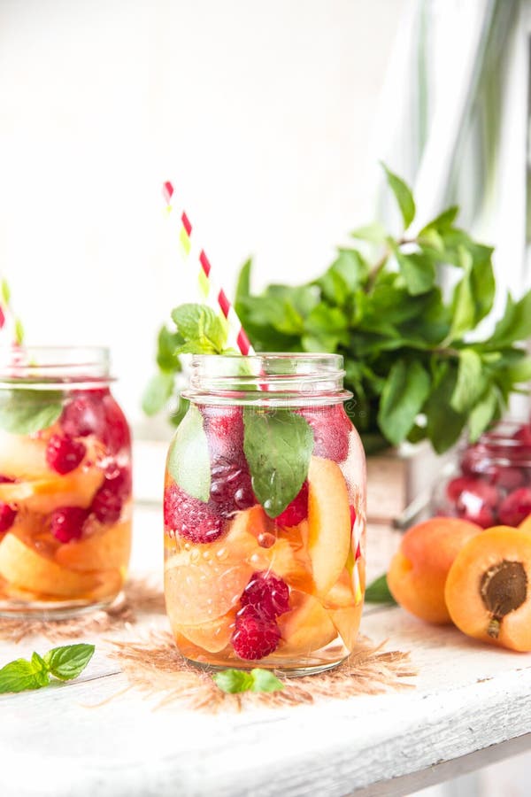 Fruit Infused Detox Water with Apricots Raspberries and Mint Stock ...