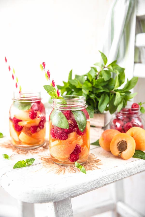 Fruit Infused Detox Water with Apricots Raspberries and Mint Stock ...