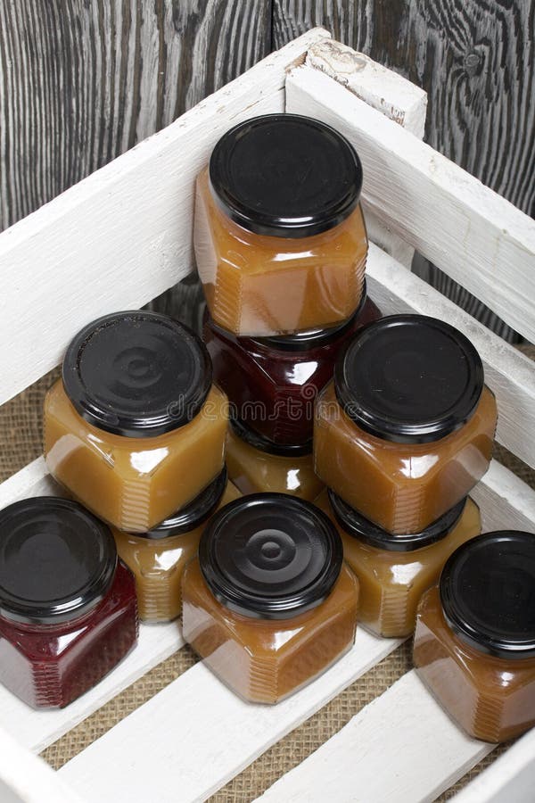 Fruit Jam in Jars. Stands in a Wooden Box Painted White Stock Photo ...