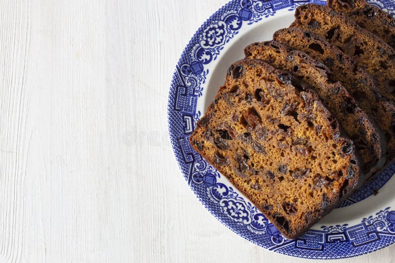 Fruit Loaf Cake Sliced on a Decorated Blue and White Plate. Stock Image ...