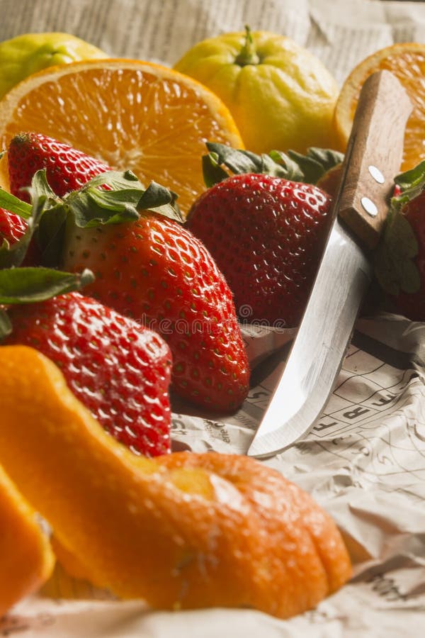 Fruit over a newspaper stock image. Image of pursple - 131072565