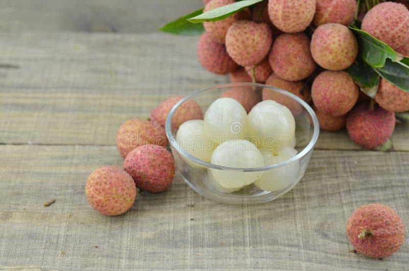 Fruit Peeled in Bowl and Fresh Lychee on Wooden Table Stock Image ...