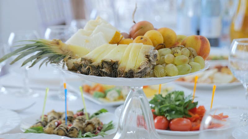 Fruit Plate on the Holiday Table. Sliced Pineapple and Fruits in a ...