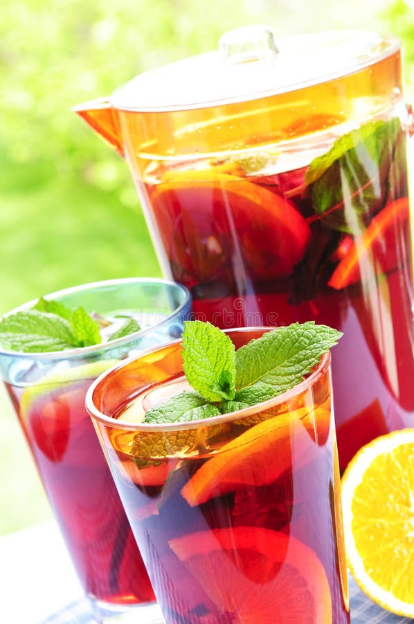 Fruit Punch in Pitcher and Glasses Stock Photo - Image of lemon, leaves ...