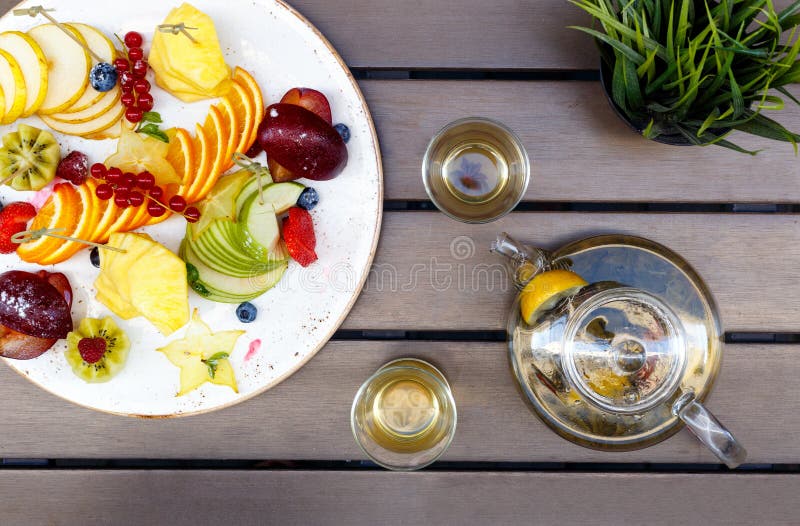 Fruit Salad and Tea on a Wooden Table Stock Photo - Image of dessert ...