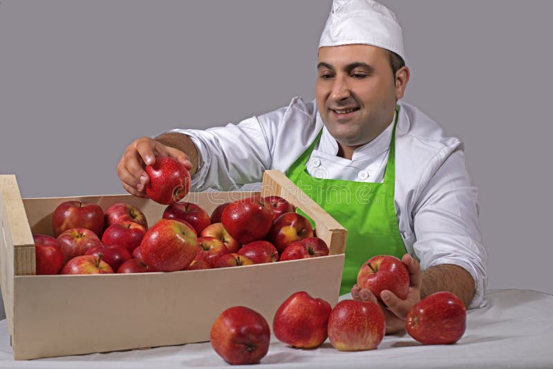 Fruit Seller with Box of Apples Stock Image - Image of mature, ordering ...