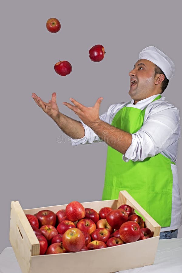 Fruit Seller Playing with Red Apples Stock Image - Image of apples ...